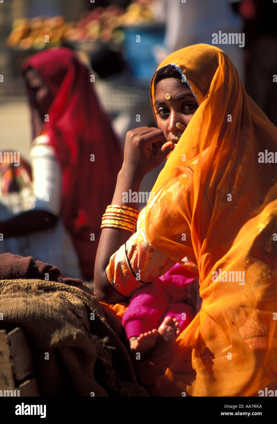 Veiled Indian market trader beauty with child, Jaisalmer, Rajasthan ...
