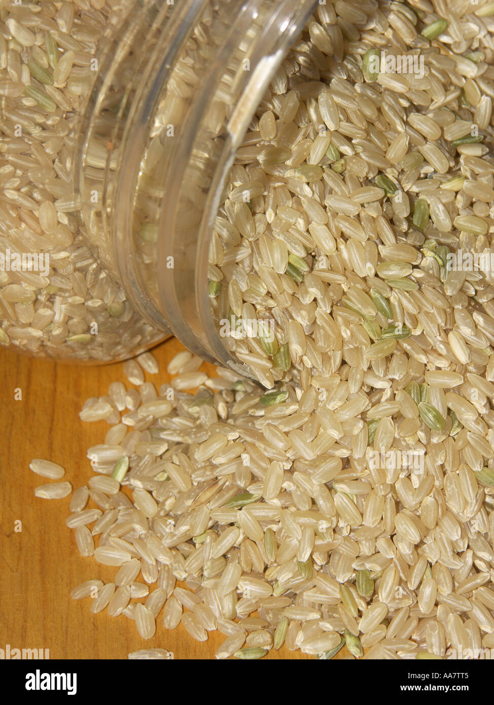 Rice flowing from a jar Stock Photo - Alamy