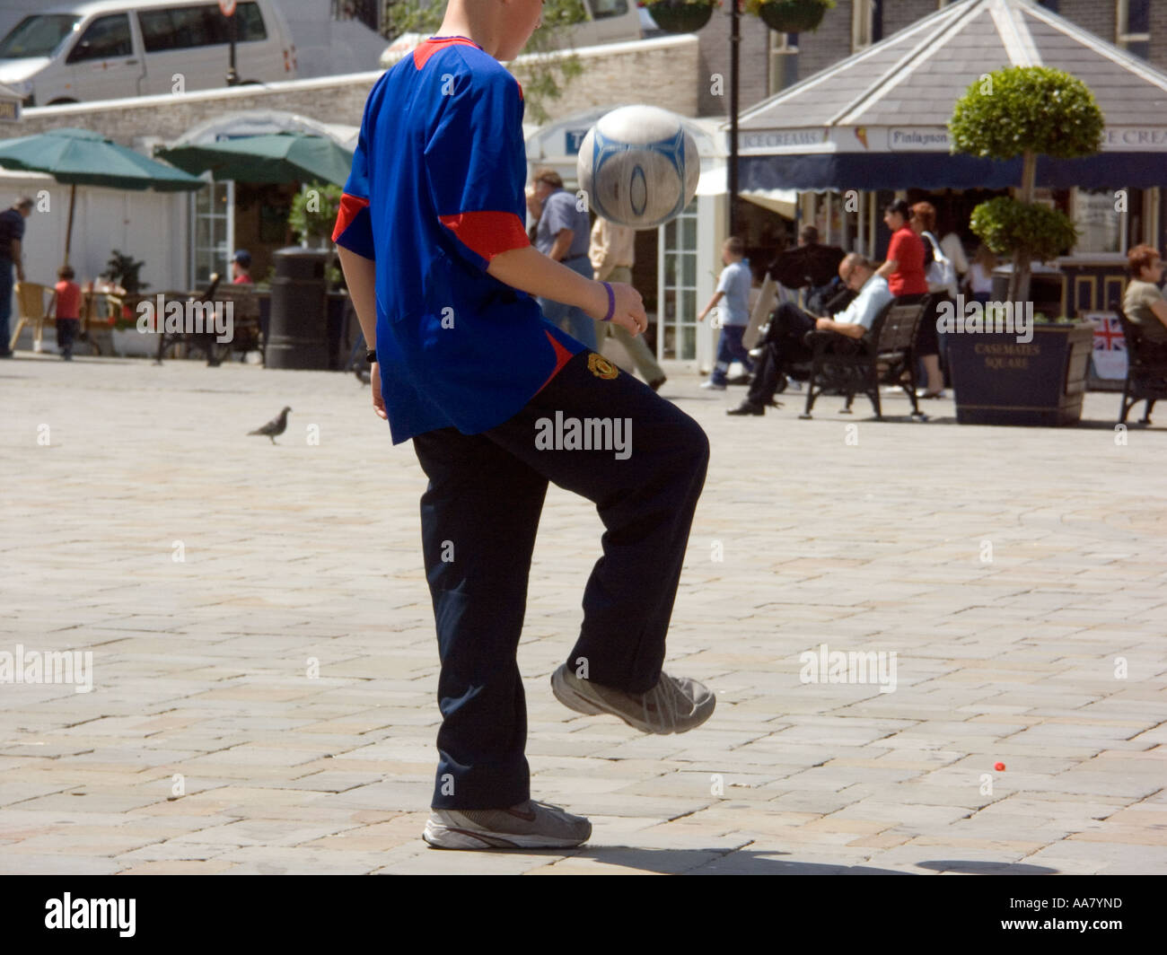 Boy playing football, Casemates Square, Gibraltar, Europe Stock Photo ...