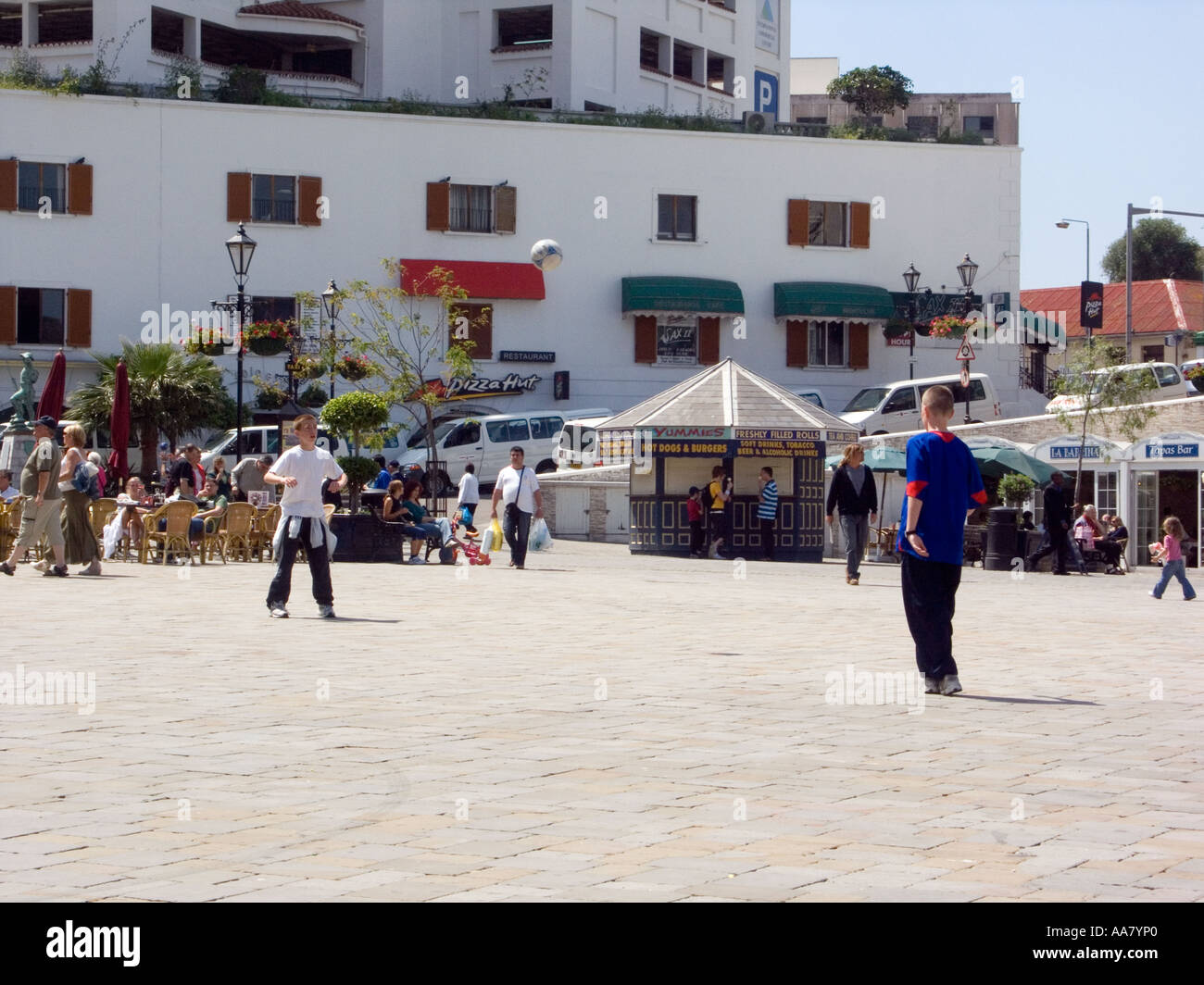 Boy playing football, Casemates Square, Gibraltar, Europe, boy playing ...