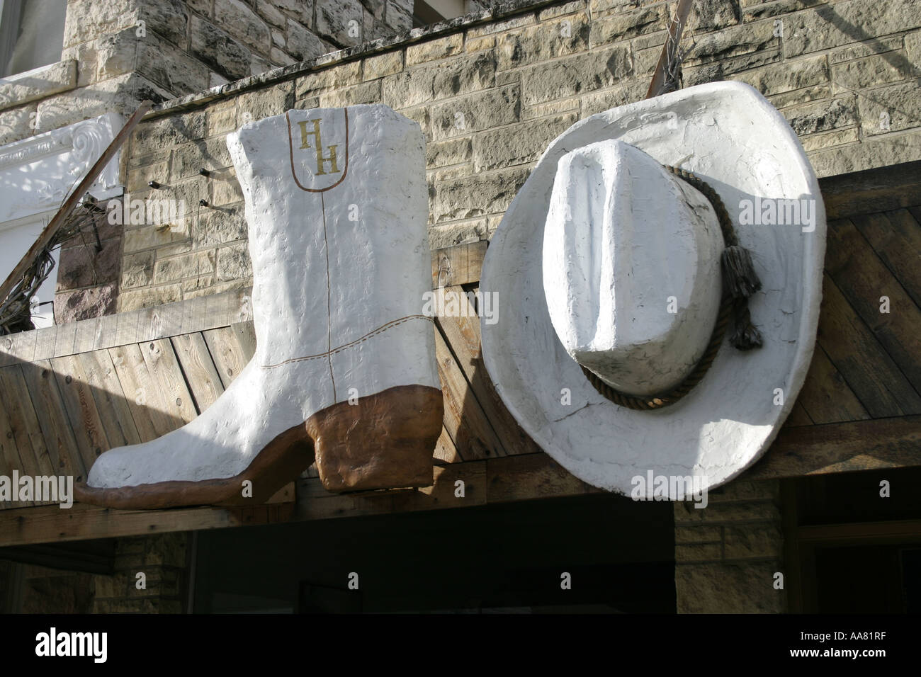 Giant Boot and Hat replicas decorate a storefront in Fredricksburg ...
