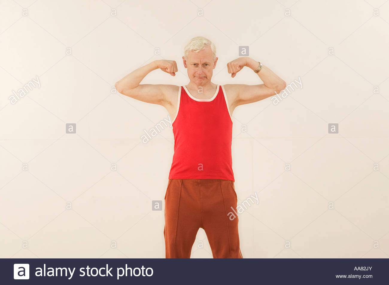 Senior Man Flexing Muscle Stock Photos & Senior Man Flexing Muscle ...
