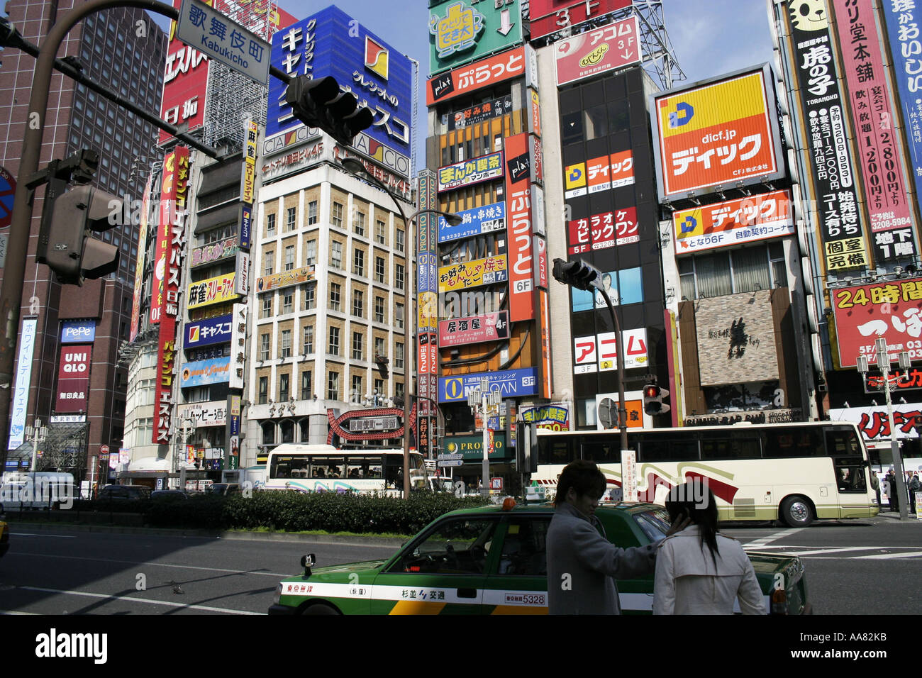 Giant signs advertising stores and products dominate the facades of ...
