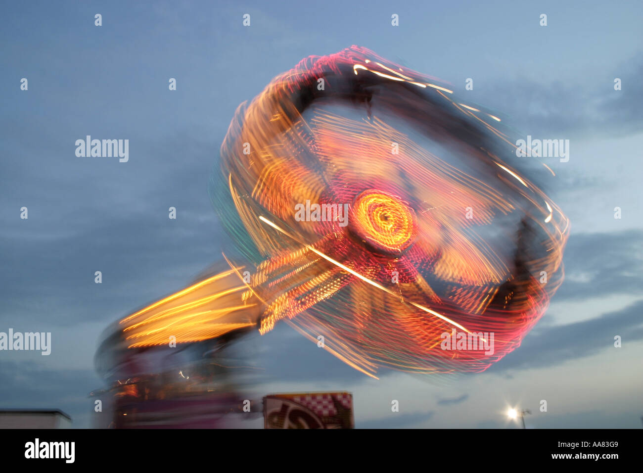 a spinning carnival ride at the Star of Texas Fair Stock Photo - Alamy