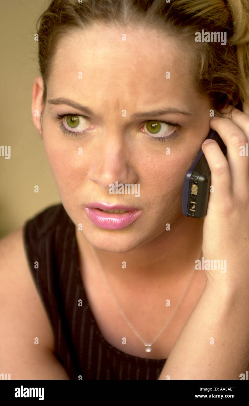 Vertical color image of an adult female with concerned expression ...