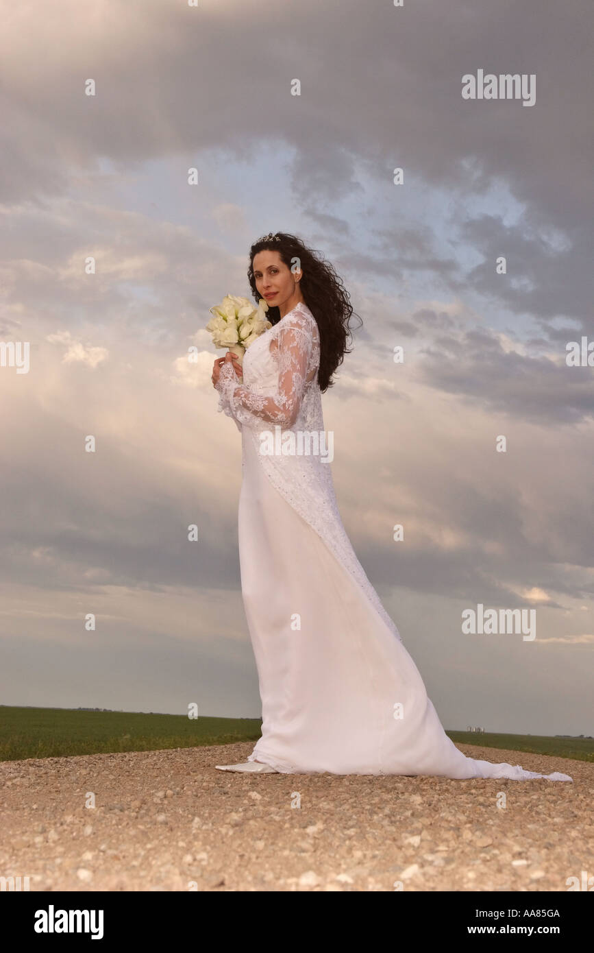 Lovely bride background by fluffy cumulus clouds in scenic Saskatchewan ...