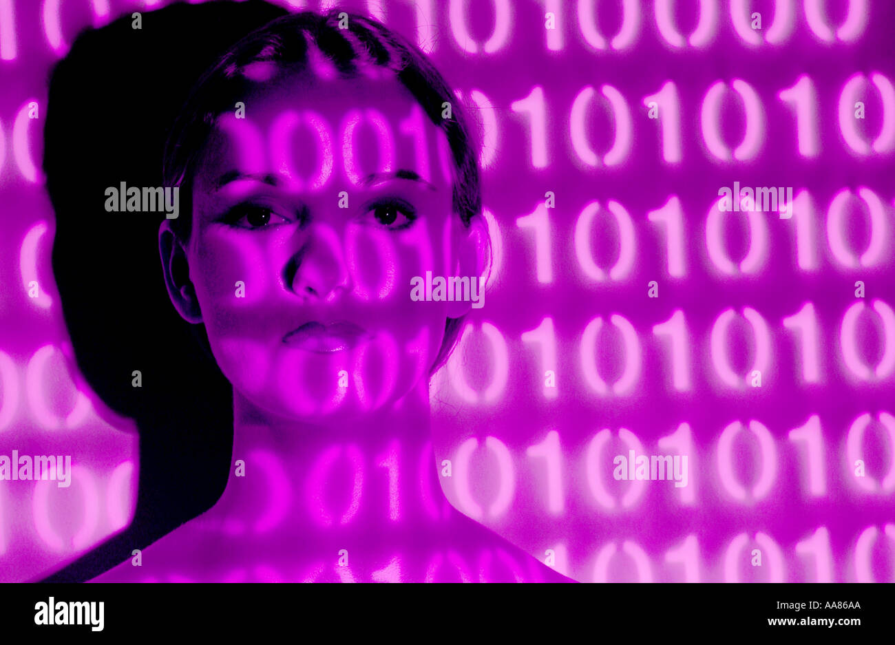 Horizontal color image of an adult female with binary code projected ...