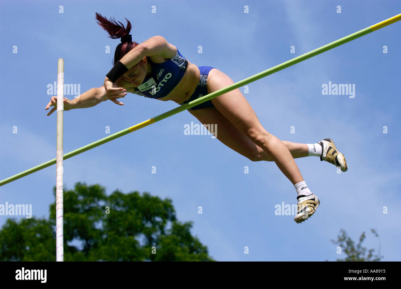 Female athlete pole vaulting Stock Photo - Alamy