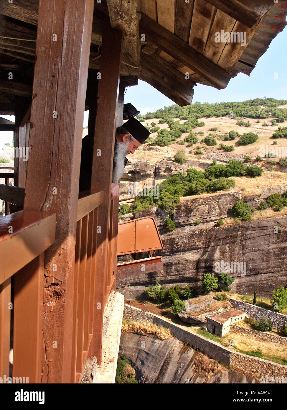 Varlaam Monastery monk looking down from elevator room balcony Meteora ...