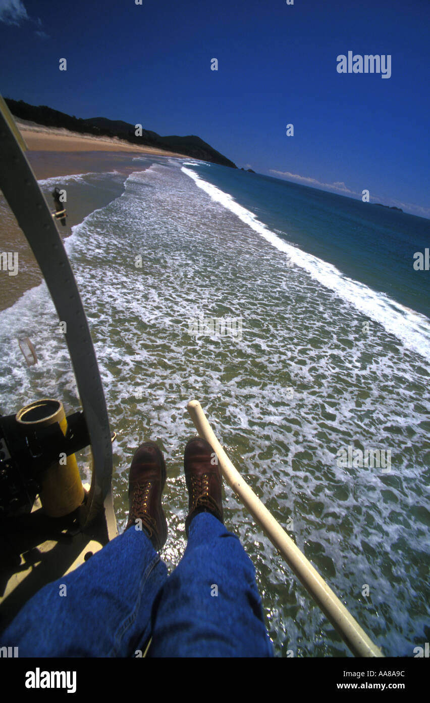 feet out of chopper over beach Stock Photo - Alamy