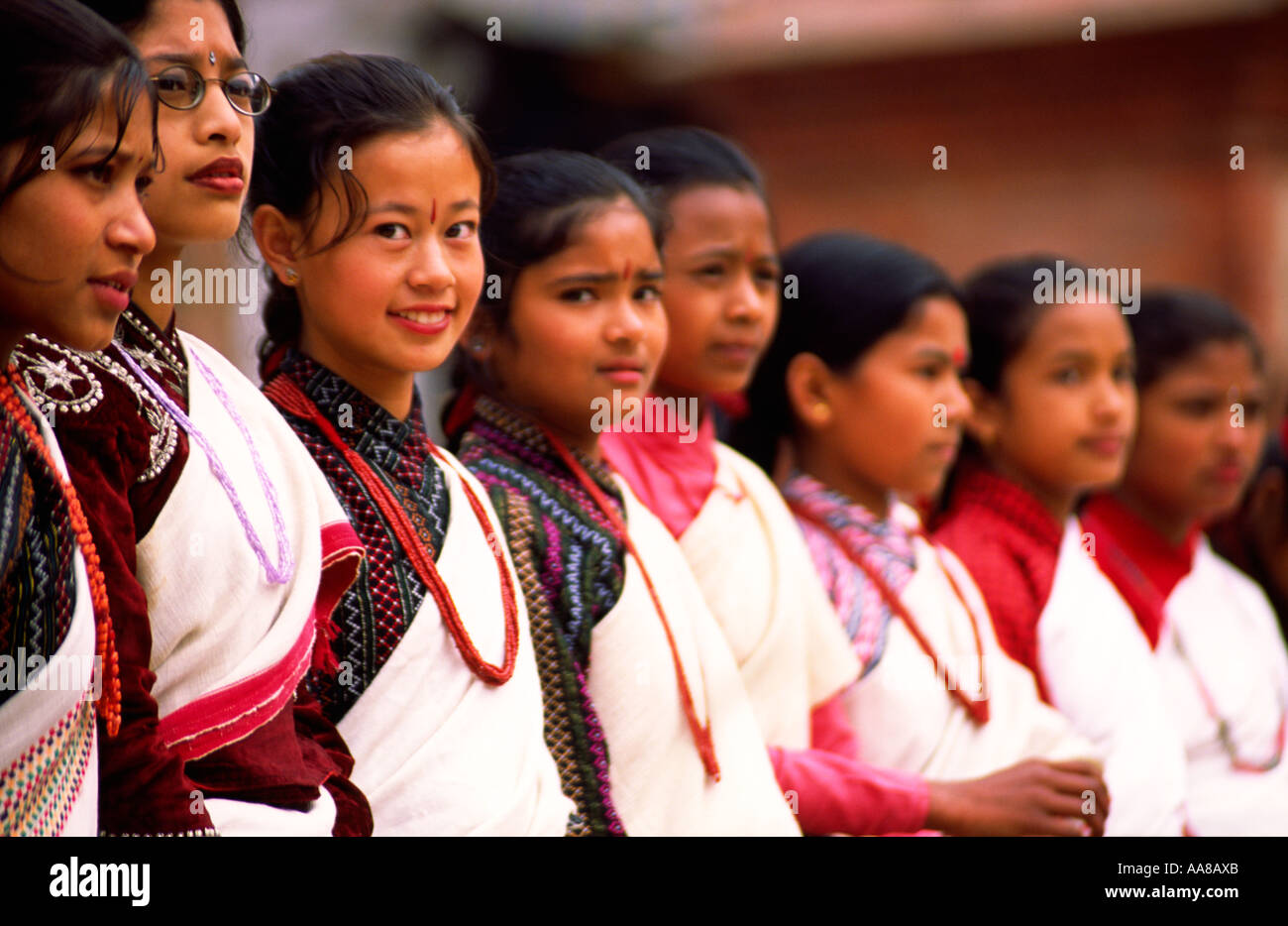 Young girls line up in traditional Nepali costume Stock Photo - Alamy