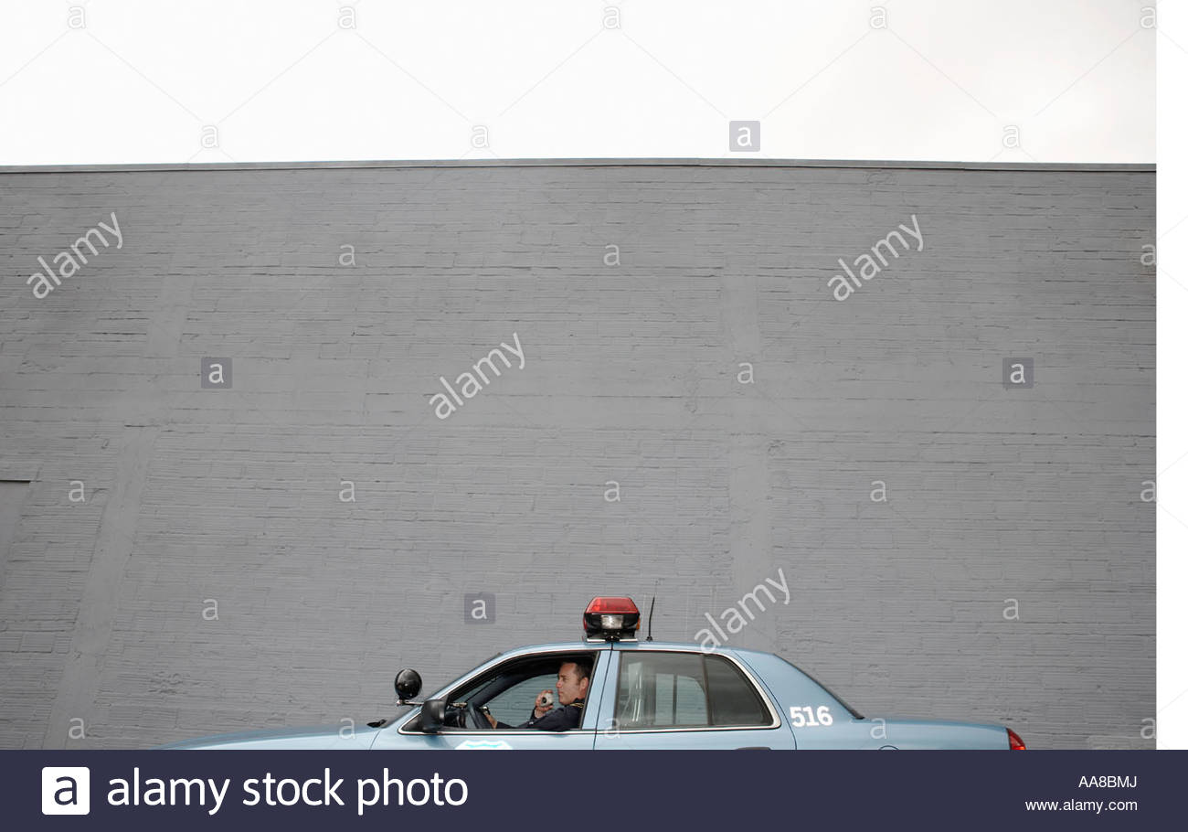 Police Driving Police Car Stock Photos & Police Driving Police Car ...