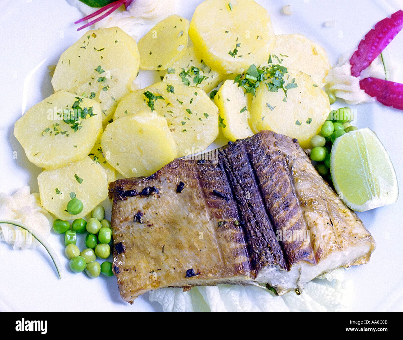 Grilled Tambaqui Fish Dish and Potatoes Stock Photo - Alamy