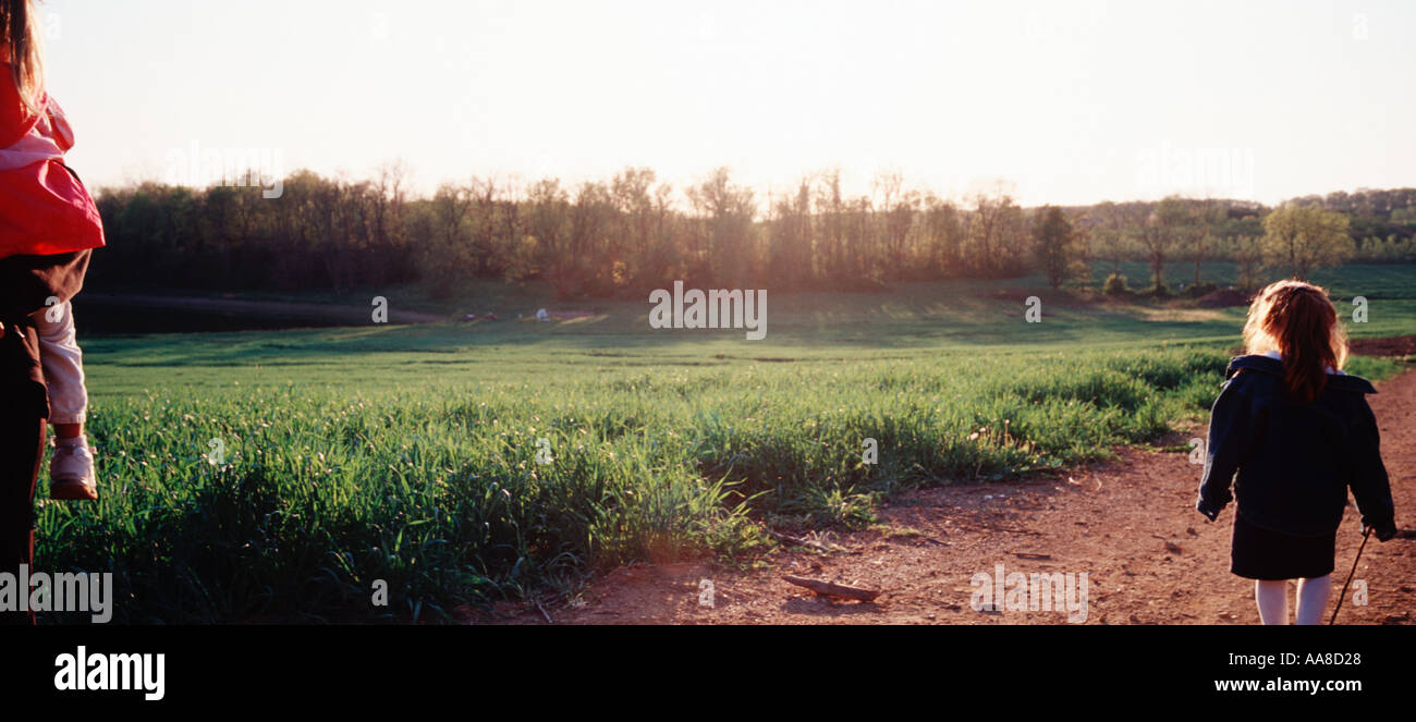 Little girl on dirt road 1 Stock Photo - Alamy