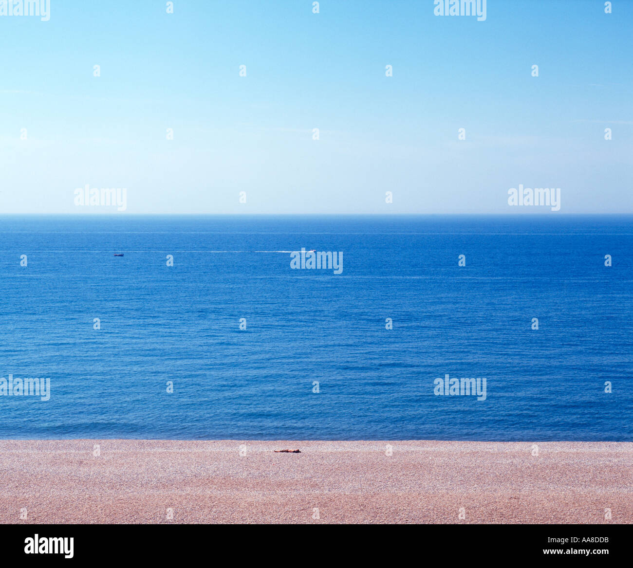 Brighton Beach in summer with sunbather Stock Photo - Alamy