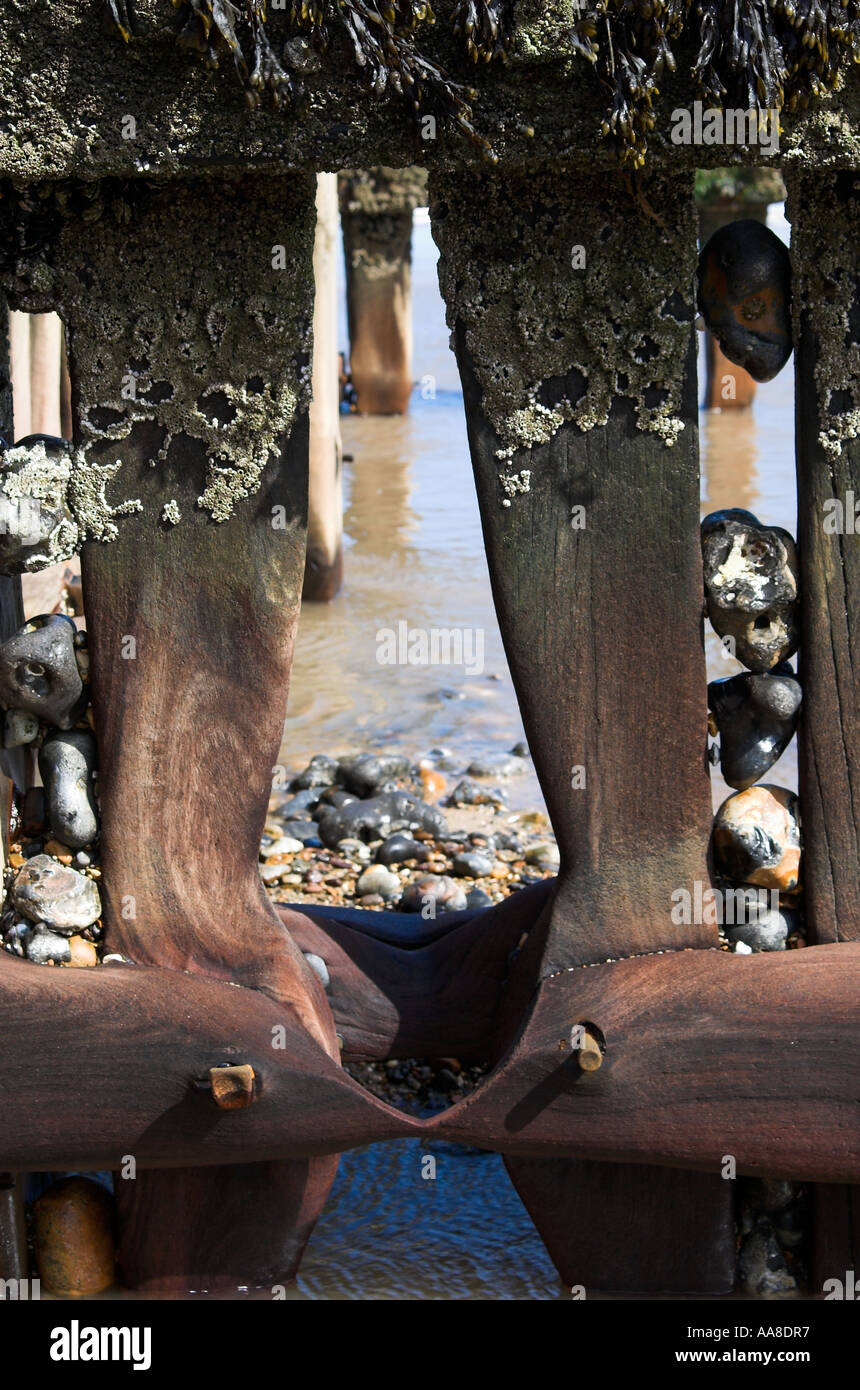 Weathered and eroded timber groynes on Mundesley beach, North Norfolk ...