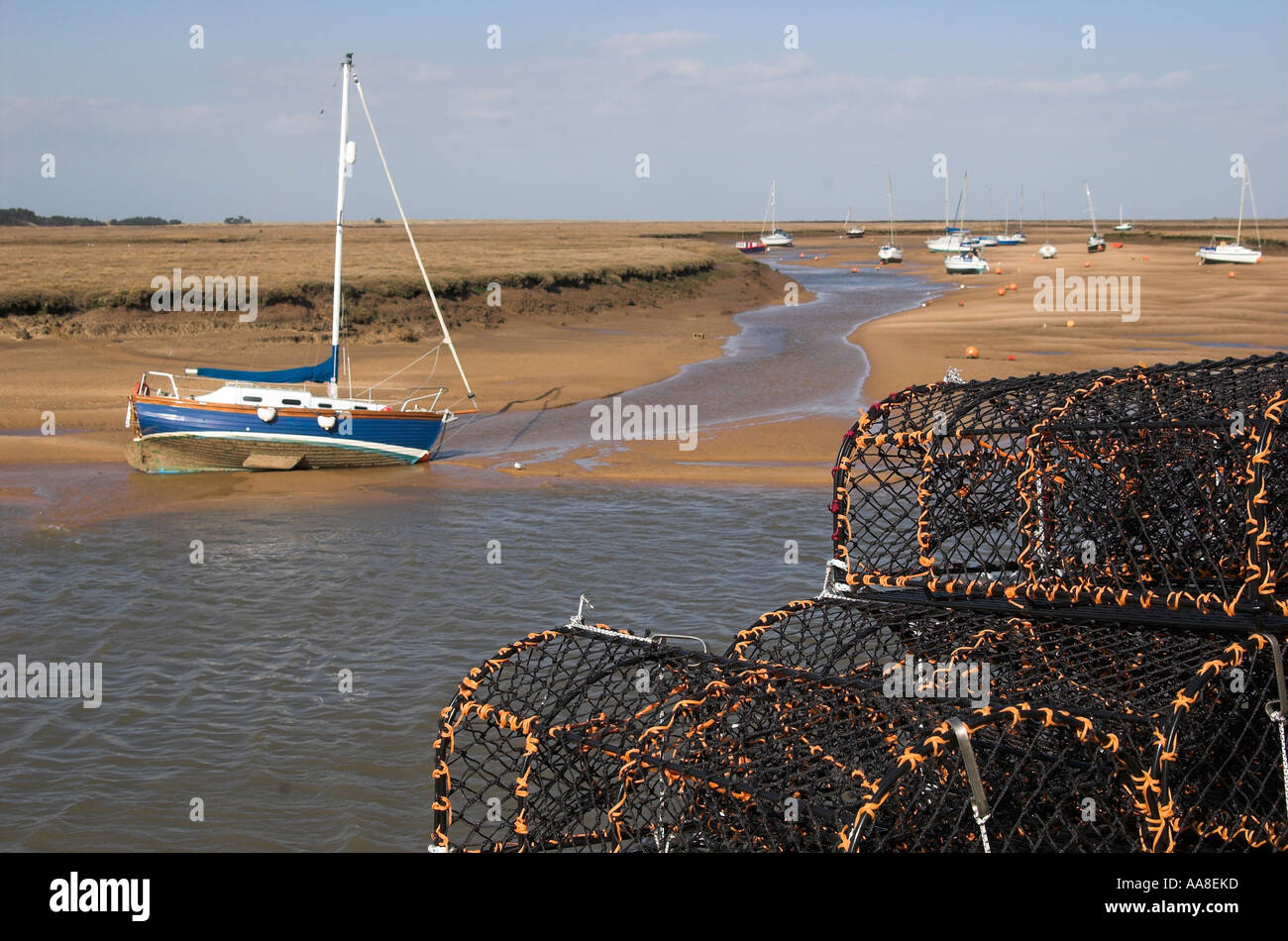 Salt marsh and sandbanks at low tide, Wells harbour, Norfolk, England ...