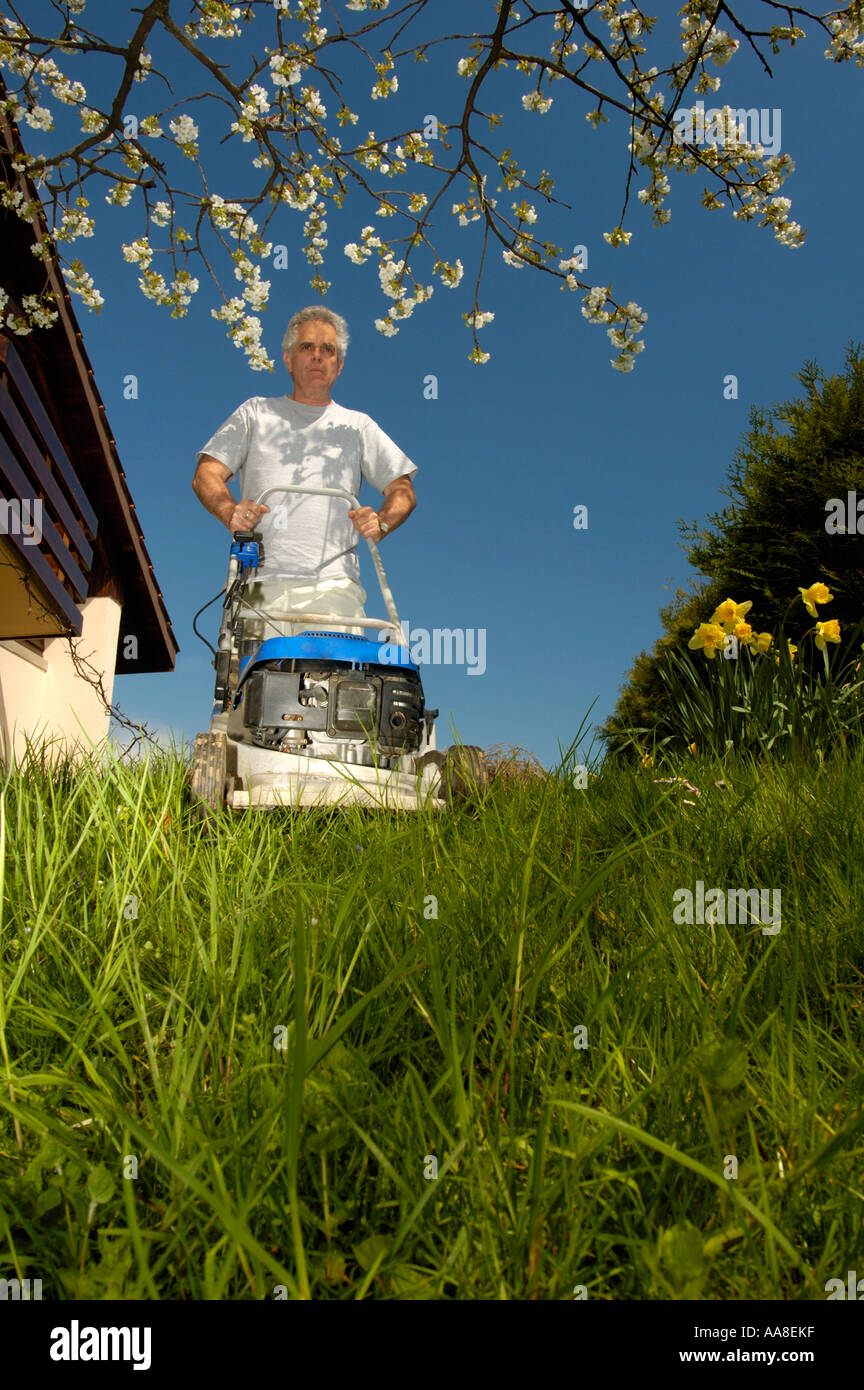 Mowing the lawn Stock Photo - Alamy