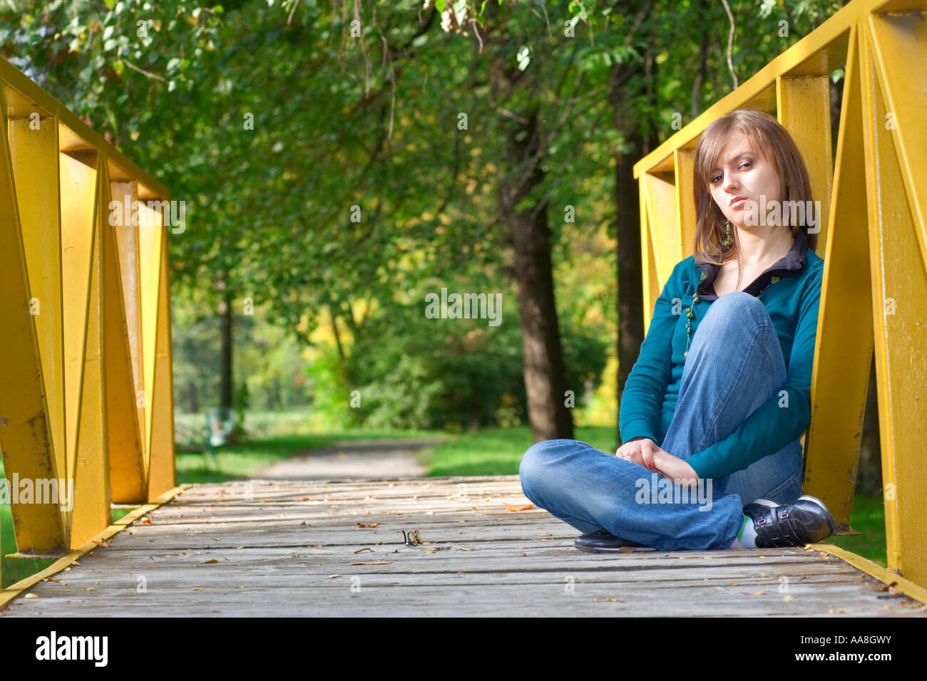 Young woman pondering in the park in Skopje Stock Photo - Alamy