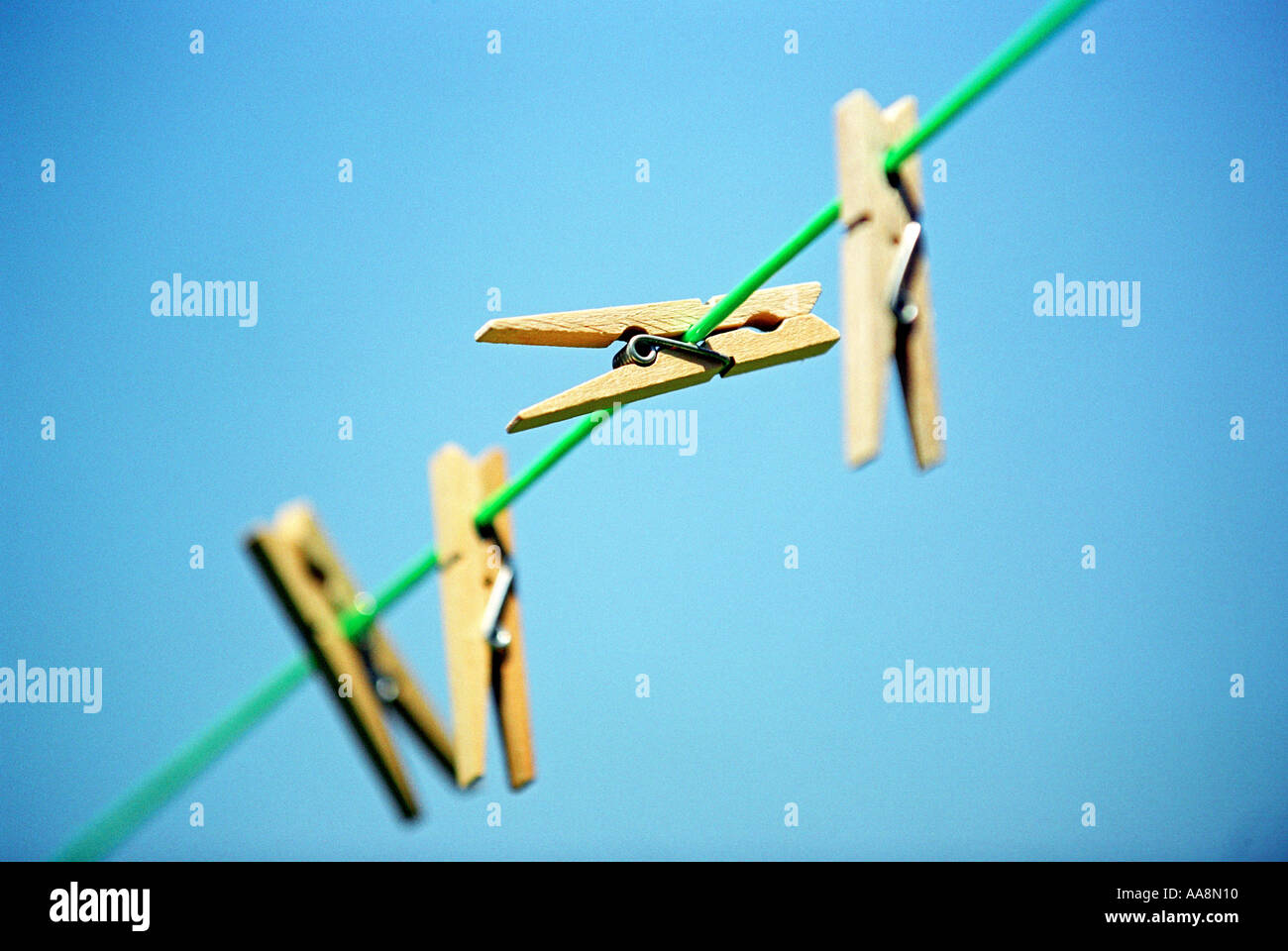Clothes pegs on a washing line Stock Photo - Alamy