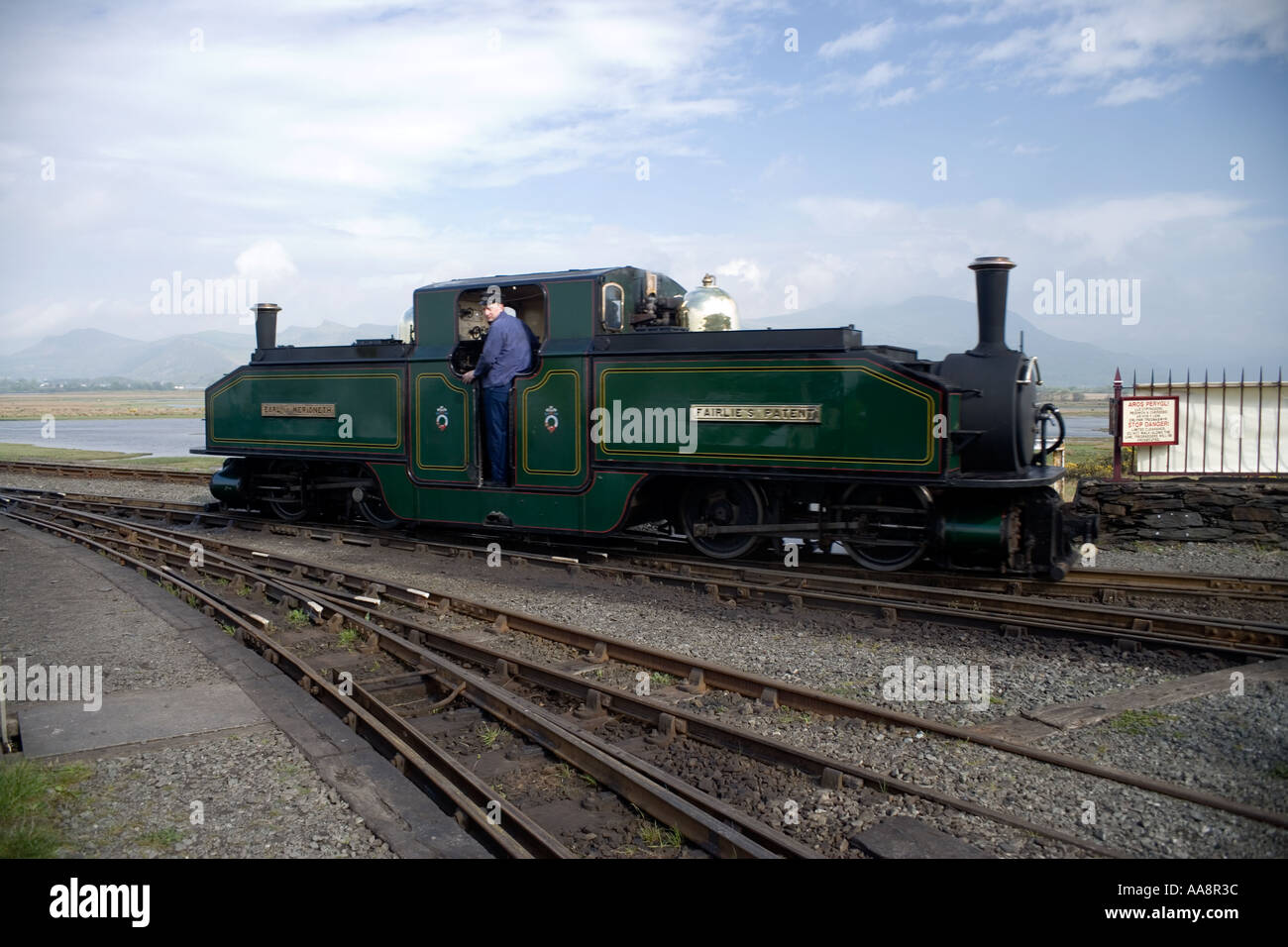 The Earl of Merioneth narrow gauge steam train crossing the cob near ...
