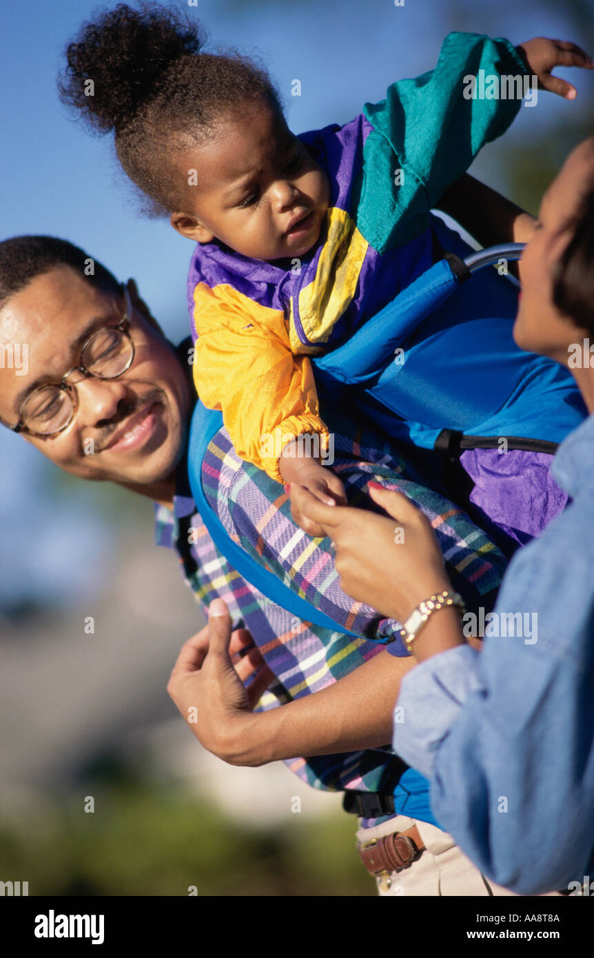 Father carrying his daughter on his back Stock Photo - Alamy