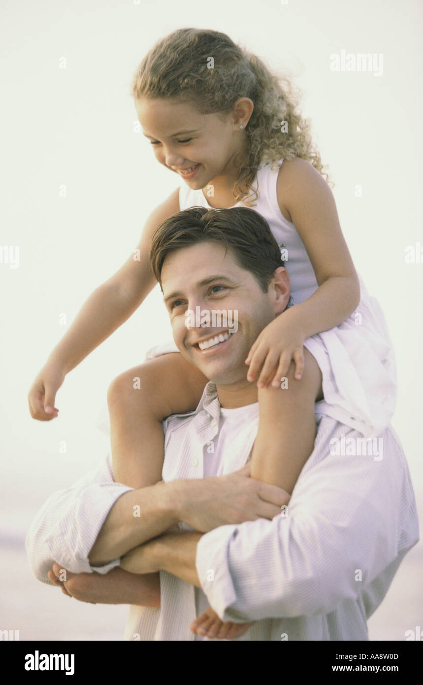 Father carrying his daughter on his shoulders Stock Photo - Alamy