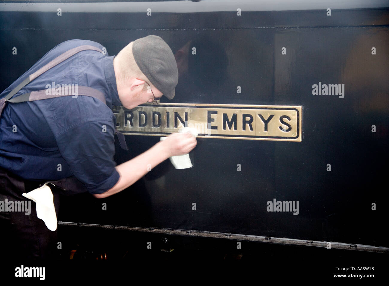 Polishing the name plate of a narrow gauge steam train in North Wales ...