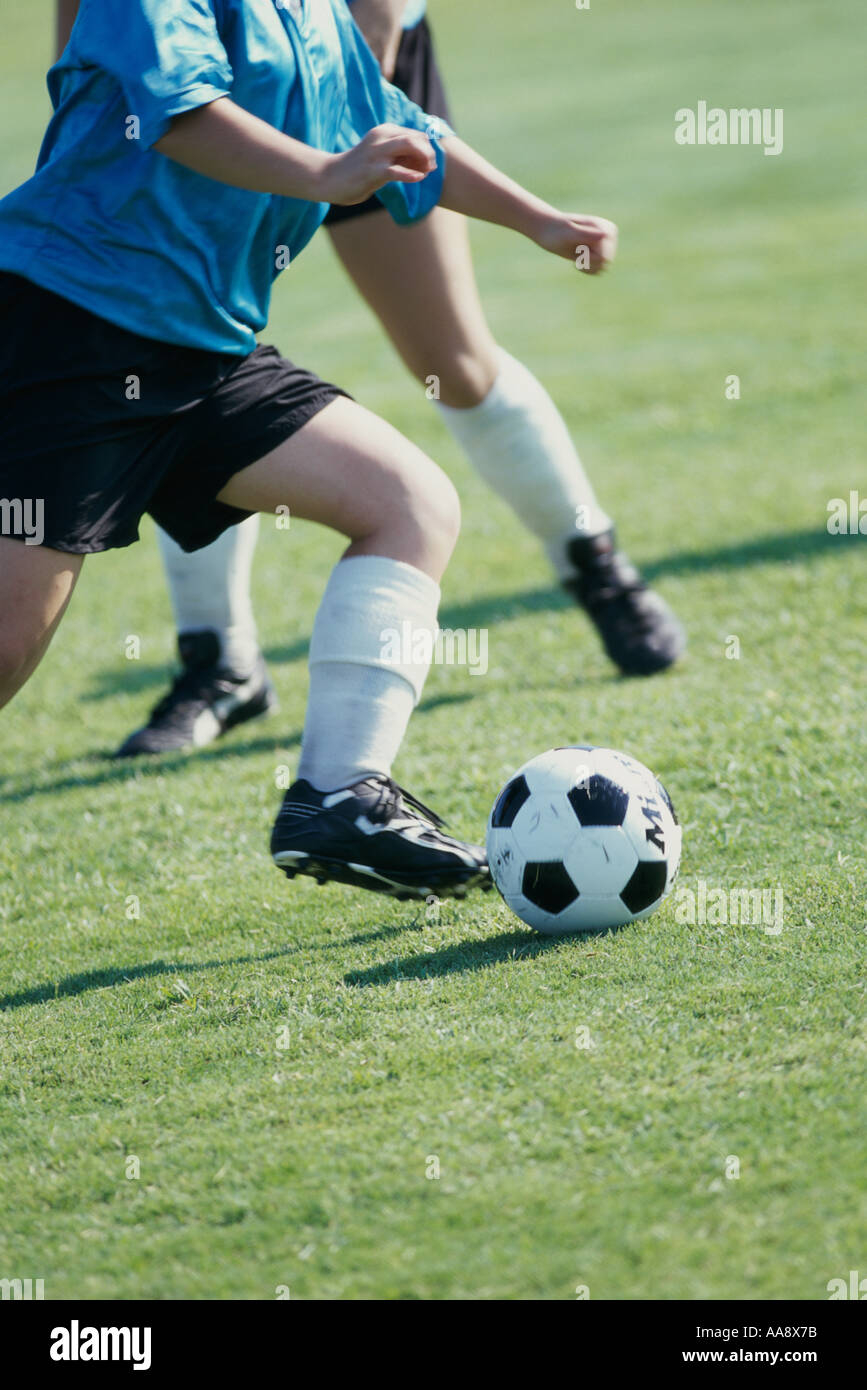 Two teenagers playing soccer Stock Photo - Alamy