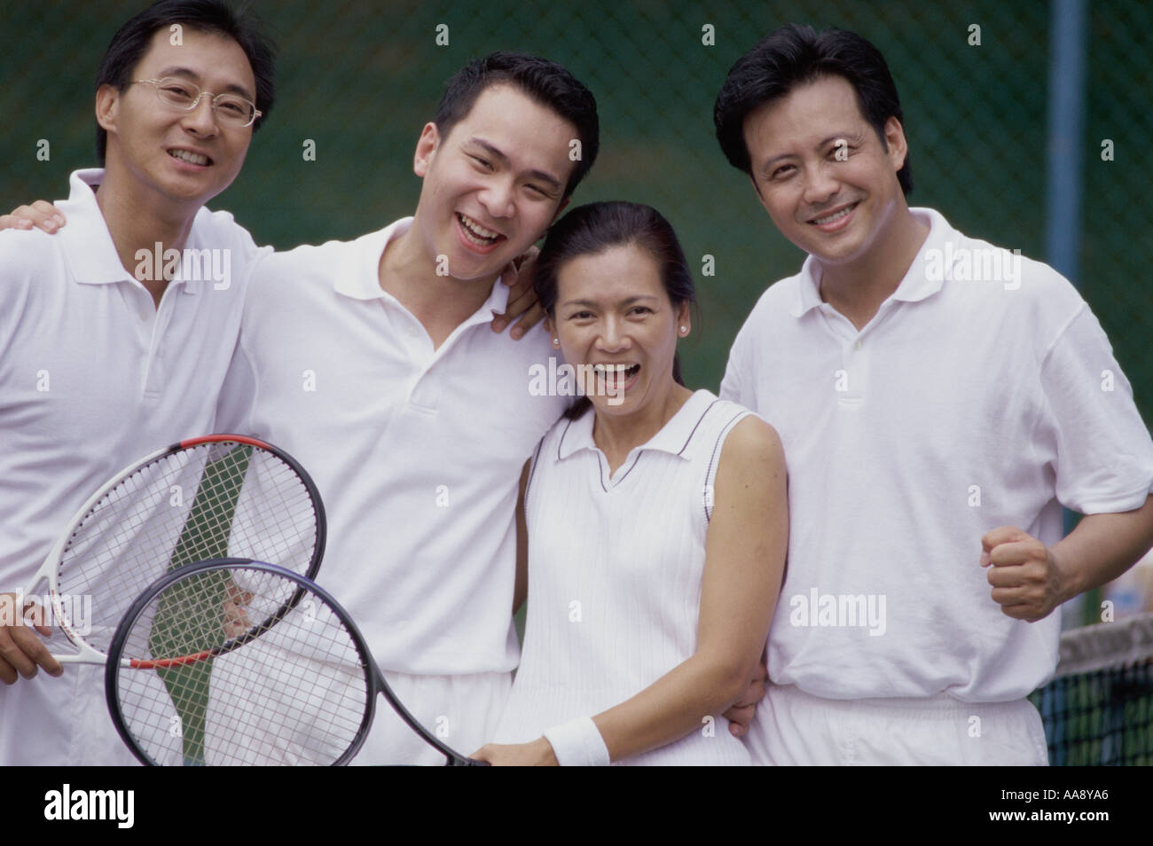 Portrait of a group of people at a tennis court Stock Photo - Alamy