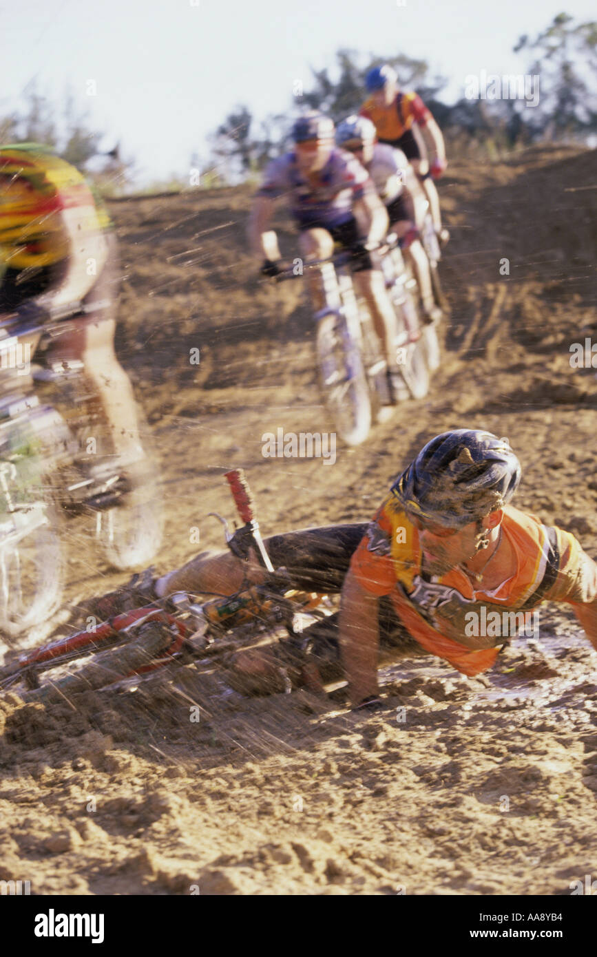 Young man falling from a bicycle in a race Stock Photo - Alamy