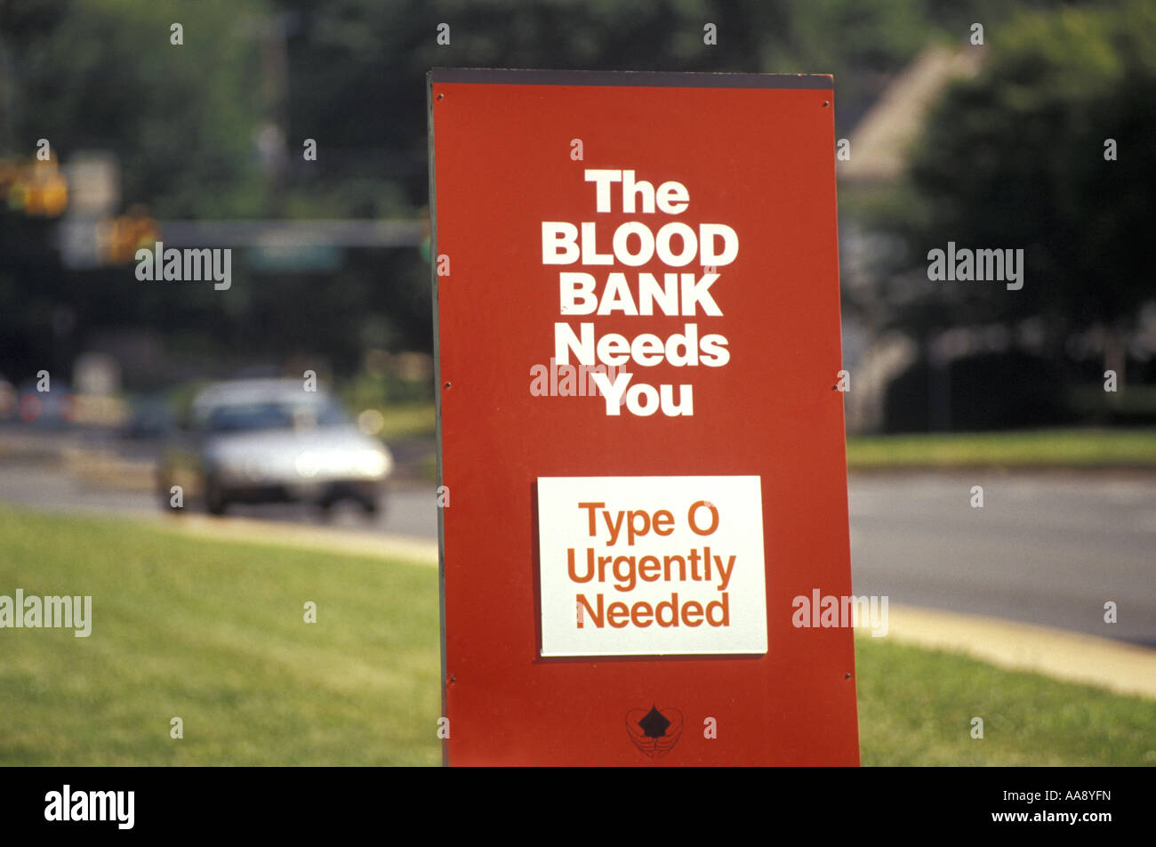 A plea on a sign placed by the side of a busy road for type O blood ...