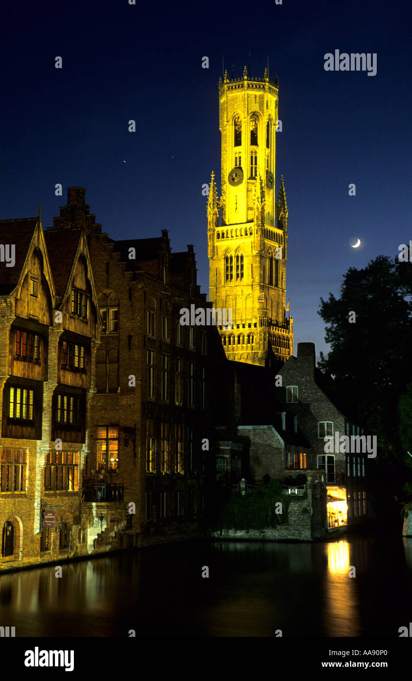 The Belfry tower overlooks canalside houses in the medieval town of ...