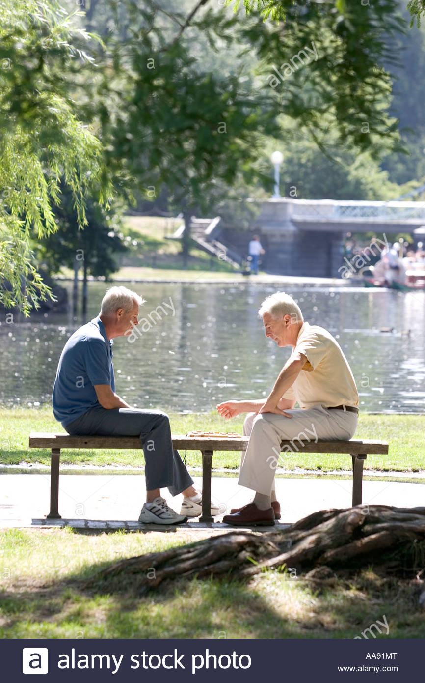 Two Men Man Sitting On A Bench Stock Photos & Two Men Man Sitting On A ...