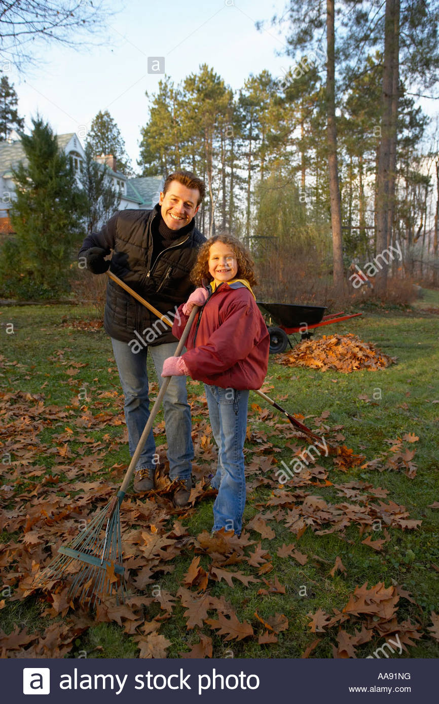 Child Raking Leaves Stock Photos & Child Raking Leaves Stock Images - Alamy