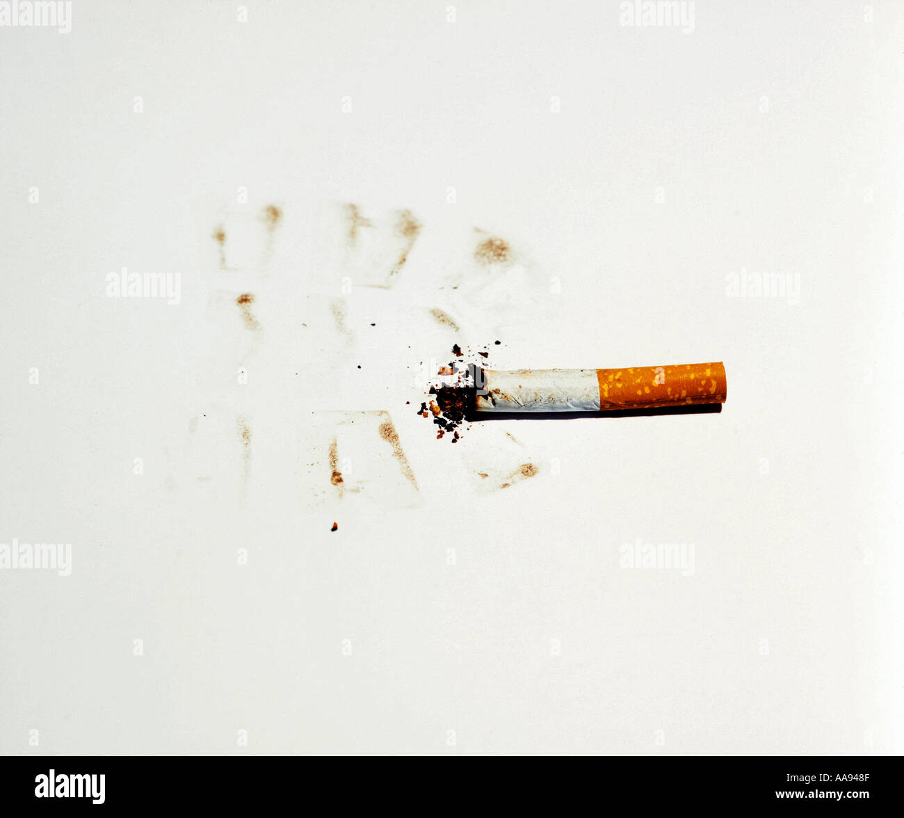 Cigarette having been stamped out by foot Stock Photo - Alamy