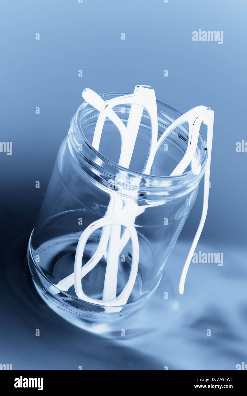 Eyeglasses in Glass Bottle Stock Photo - Alamy