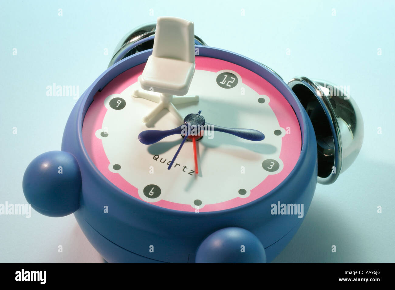 Miniature Chair on Alarm Clock Stock Photo - Alamy