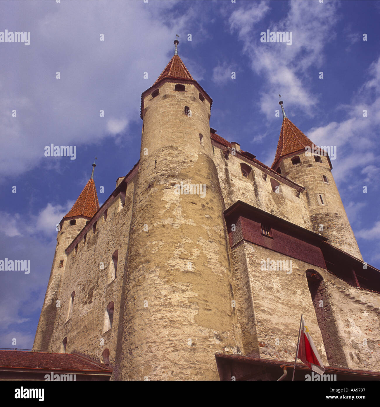 View up at the main tower and rounded corner turrets of Schloss Thun ...