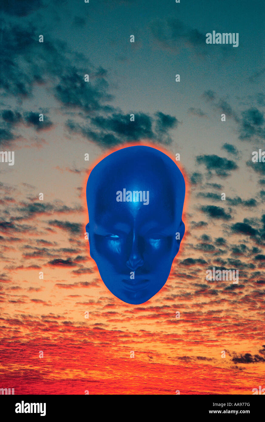 Concept. Blue head floating mid-air in sunset sky Stock Photo - Alamy