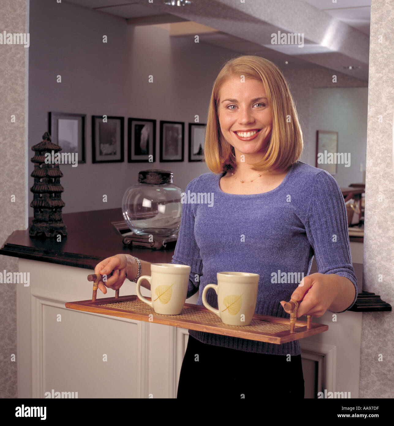 Woman Serving Coffee on a Tray Stock Photo - Alamy