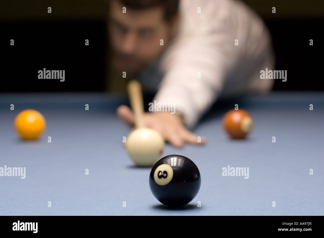 Young person playing snooker in a club Stock Photo - Alamy