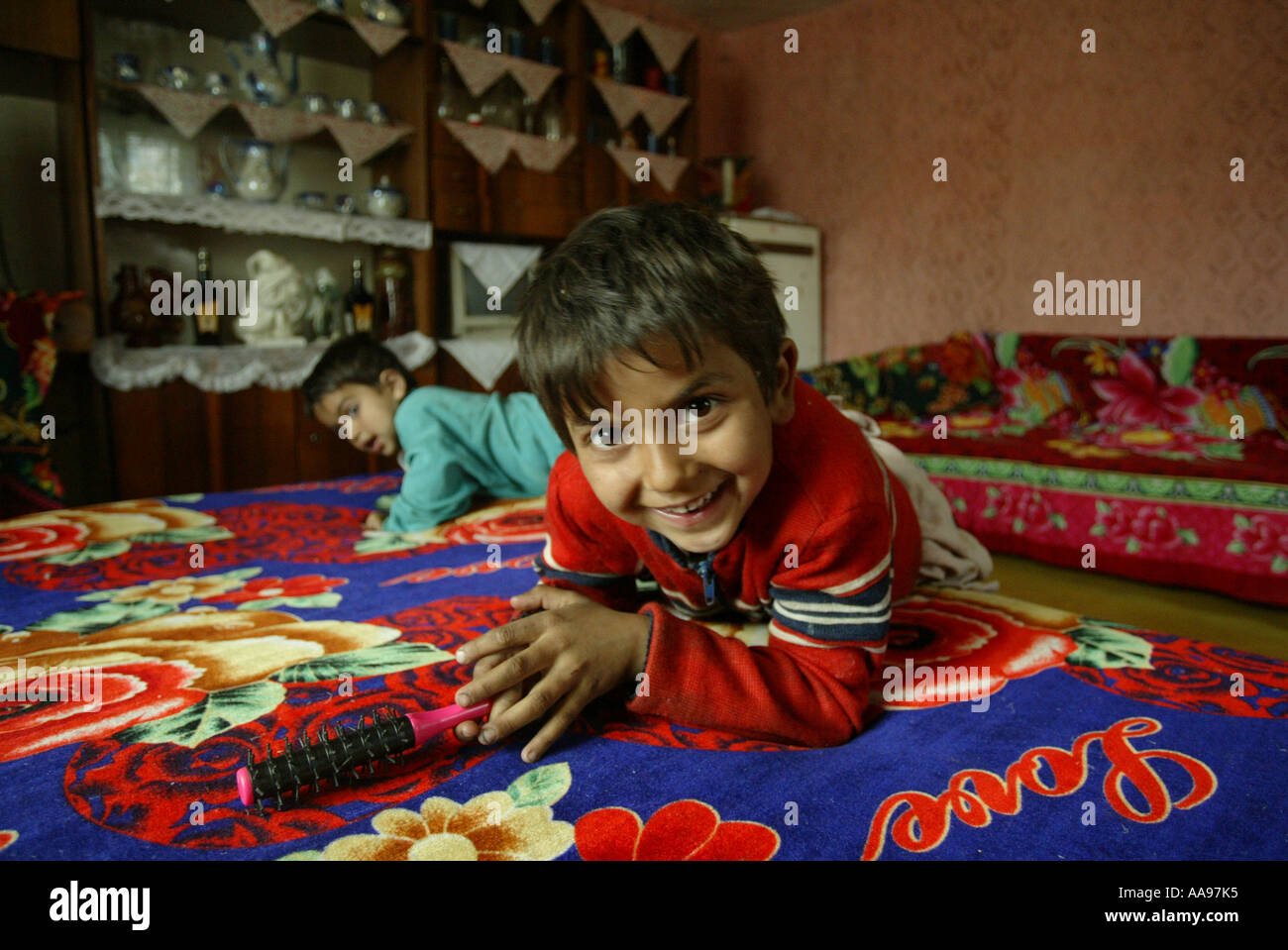 TWO ROMA GYPSY CHILDREN IN A HOUSE ON A SITE NEAR KOSICE IN SLOVAKIA ...