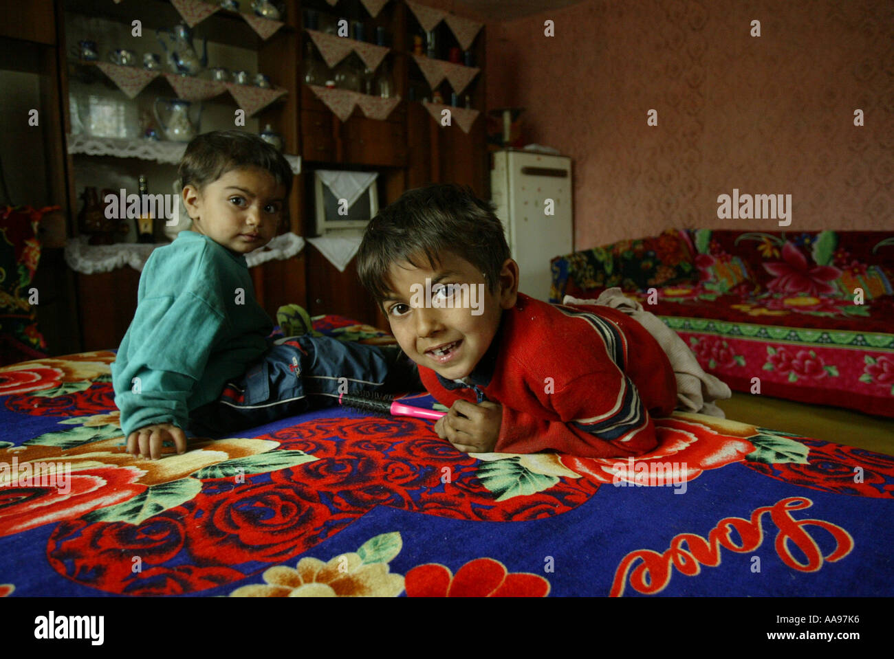 TWO ROMA GYPSY CHILDREN IN A HOUSE ON A ROMA GYPSY SITE NEAR KOSICE IN ...