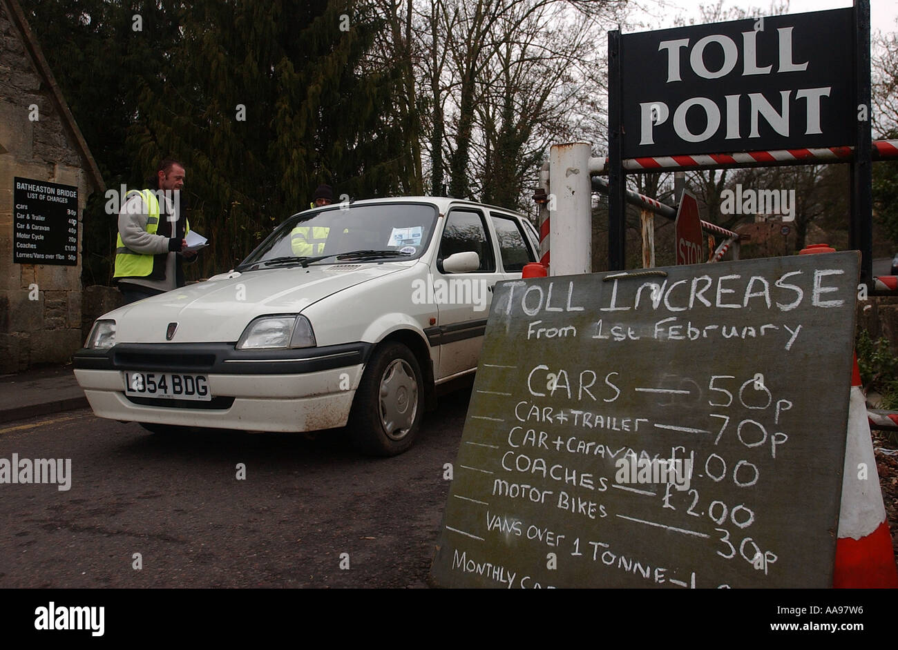 A CAR PASSES A TOLL POINT ON A TOLL BRIDGE NEAR BATH, SOMERSET, ENGLAND ...