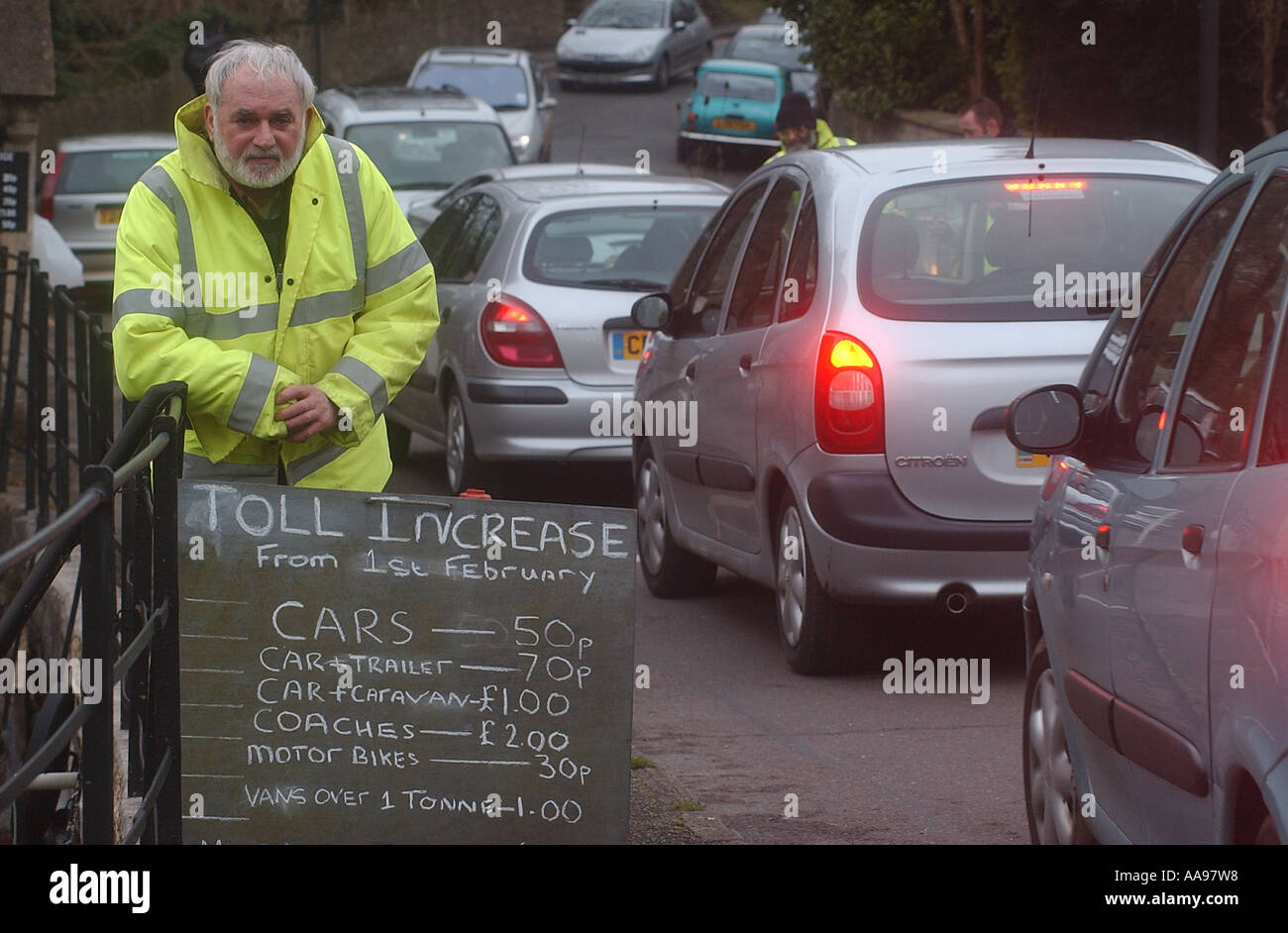 A TOLL COLLECTOR STANDS AT A TOLL POINT ON A BRIDGE IN BATH Stock Photo ...