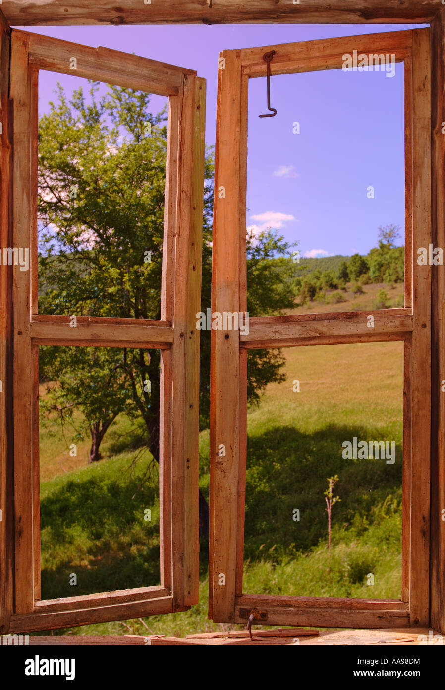 Landscape seen through an old window Stock Photo - Alamy