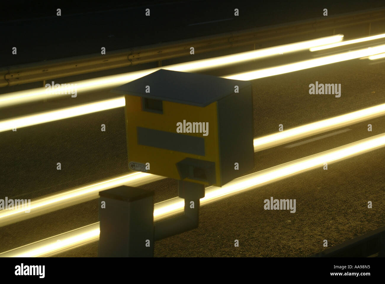 A GATSO SPEED CAMERA IS SEEN IN ACTION BESIDES A BUSY ROAD WITH THE ...