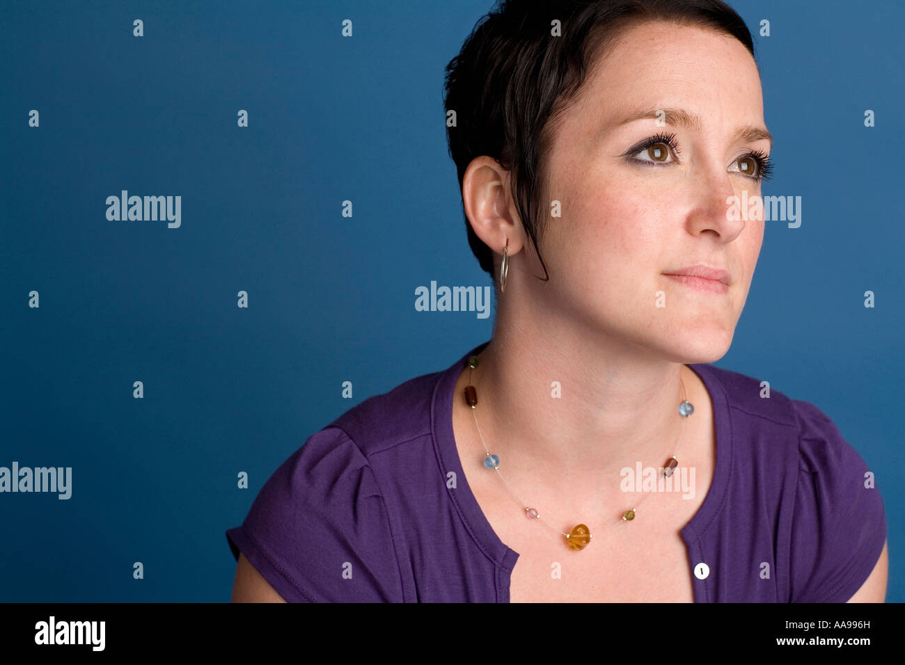 Young woman stares into the distance Stock Photo - Alamy