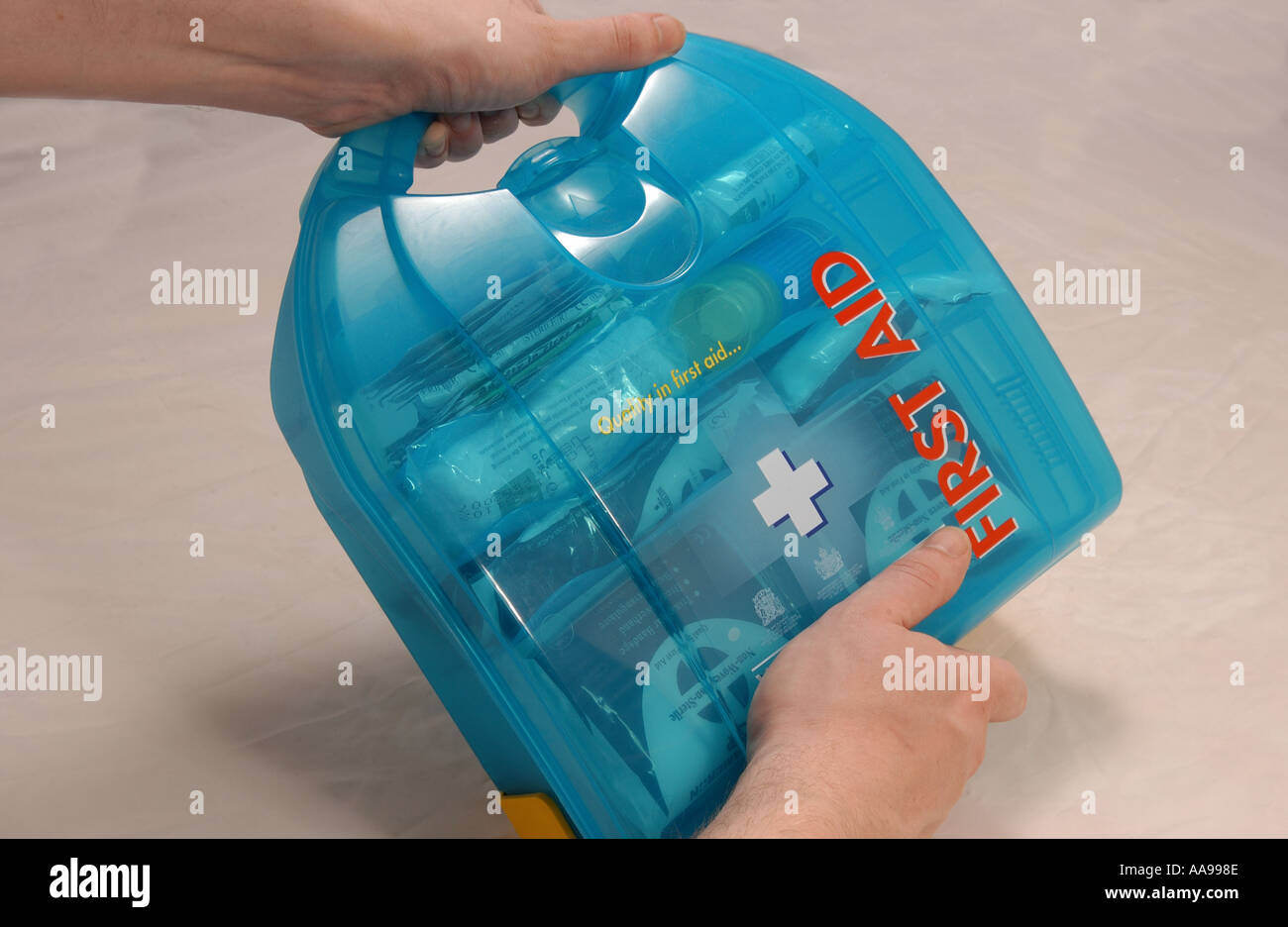 hands holding first aid kit Stock Photo - Alamy